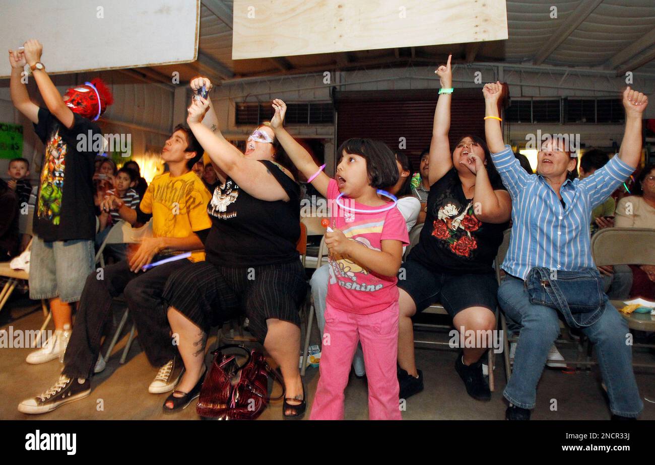 This Friday, April 30, 2010 photo shows fans as they cheer during a ...