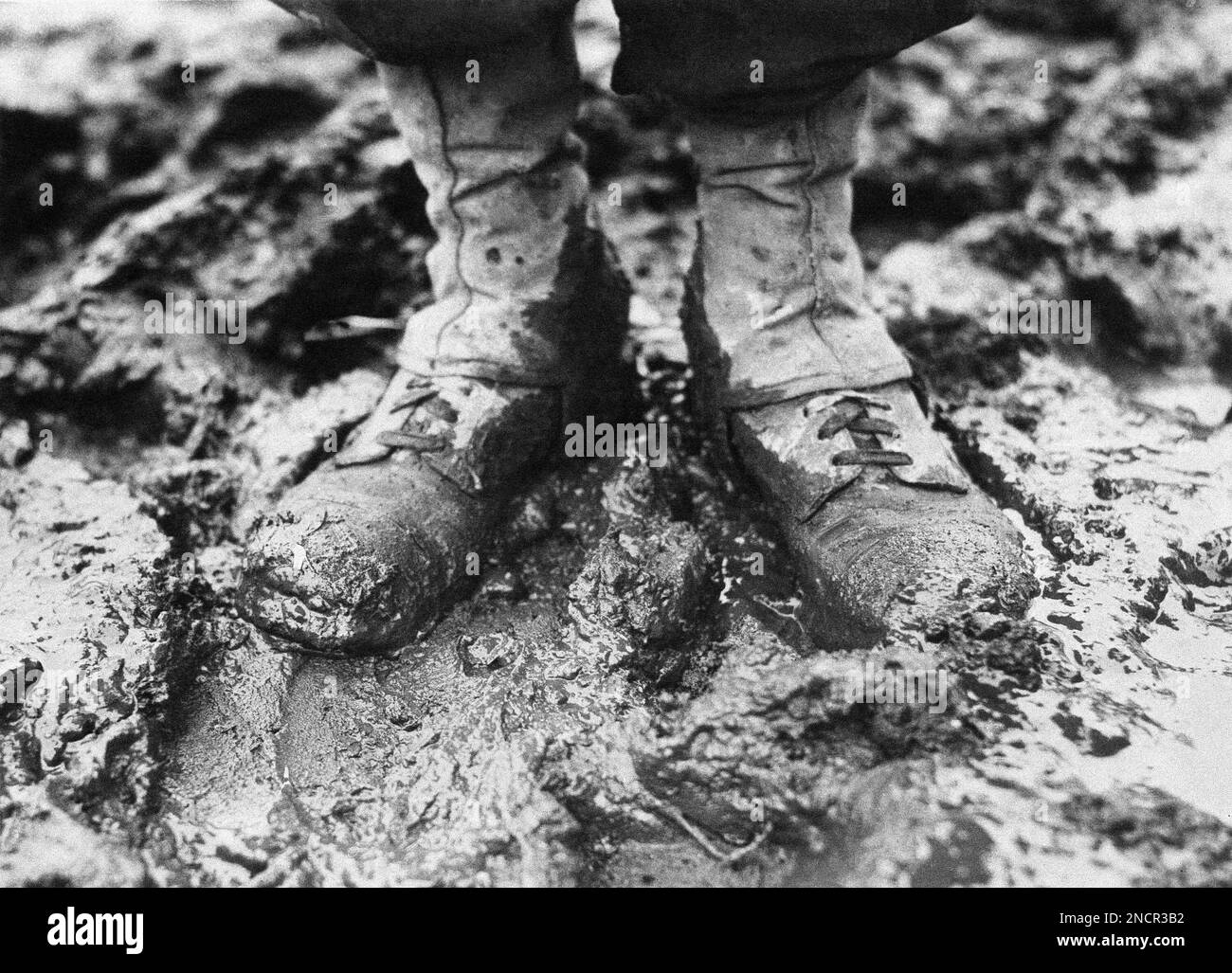 The feet of an American soldier-builder slopping in the mud at Lambeth ...