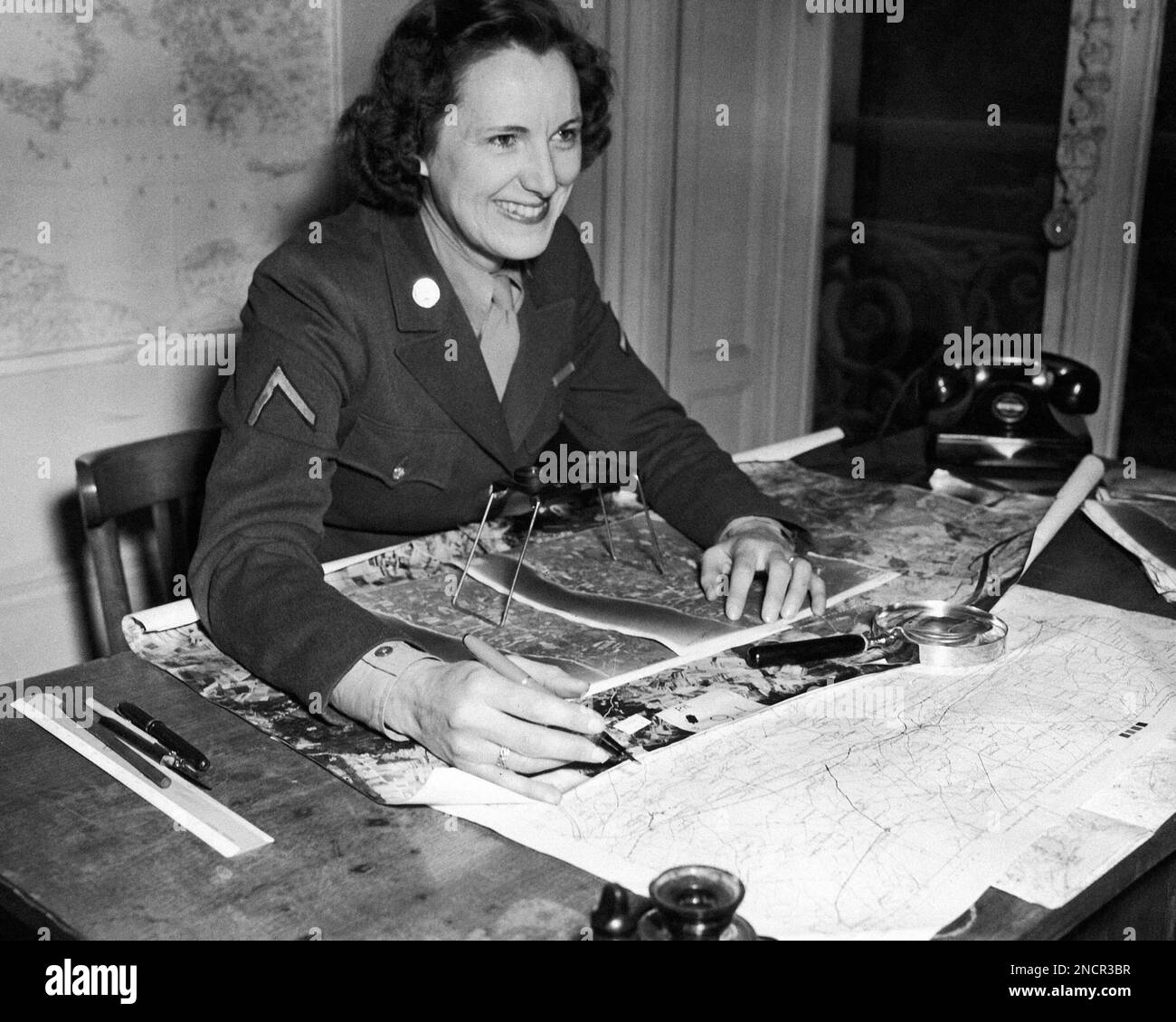 WAC Pfc. Mildred I. Smith, of Onarga Ill., who majored in geography at ...