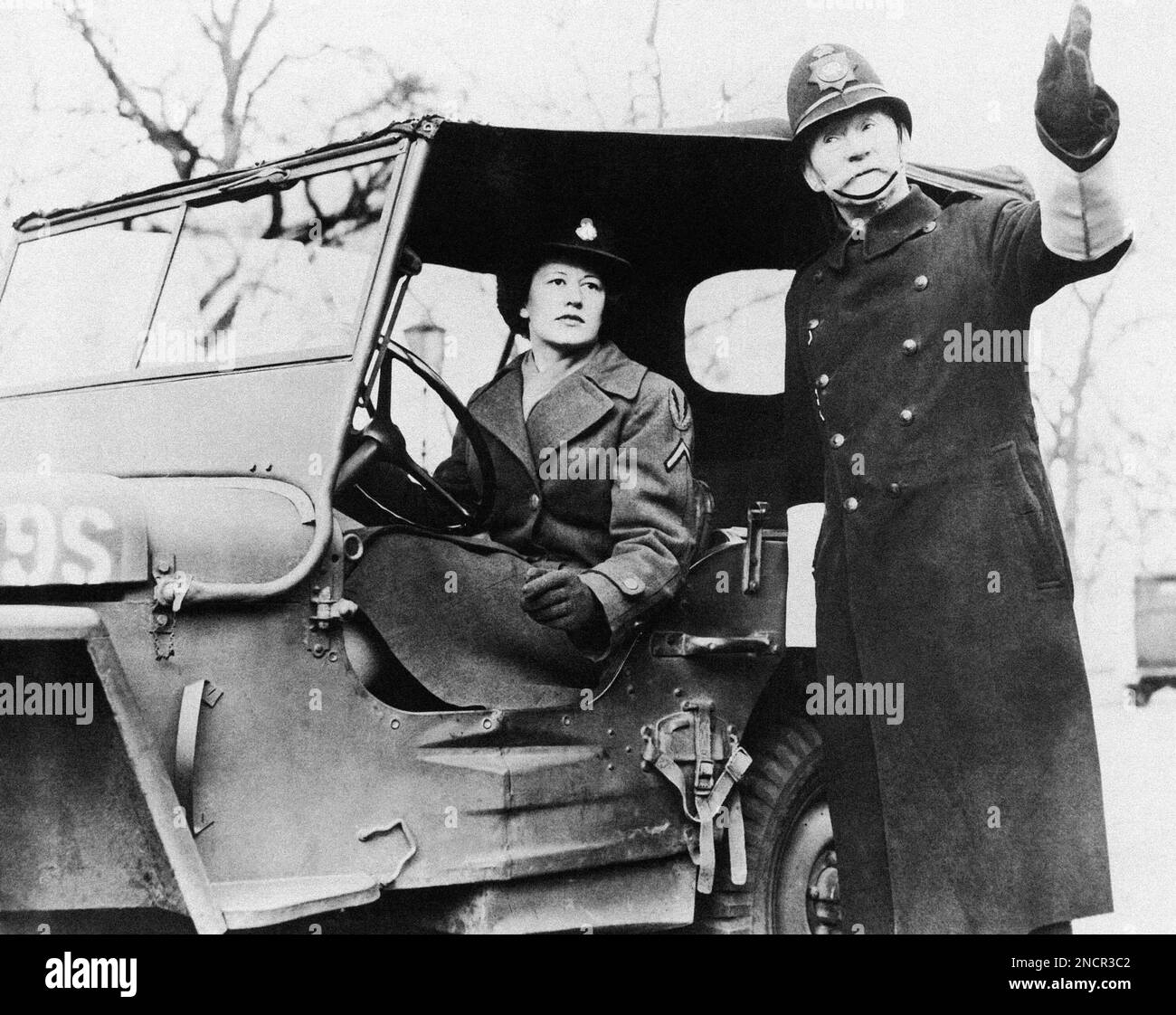 WAC driver Private First Class Pat Paust, of New York City, is given ...