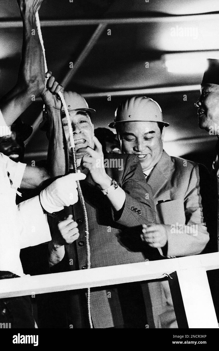Wearing helmets, communist Chinese Premier Chou En-Lai, left, and North ...