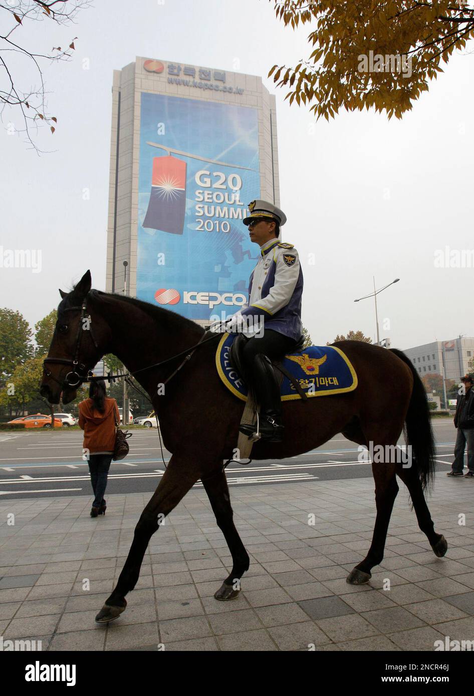 A South Korean mounted policeman patrols near the venue for the ...