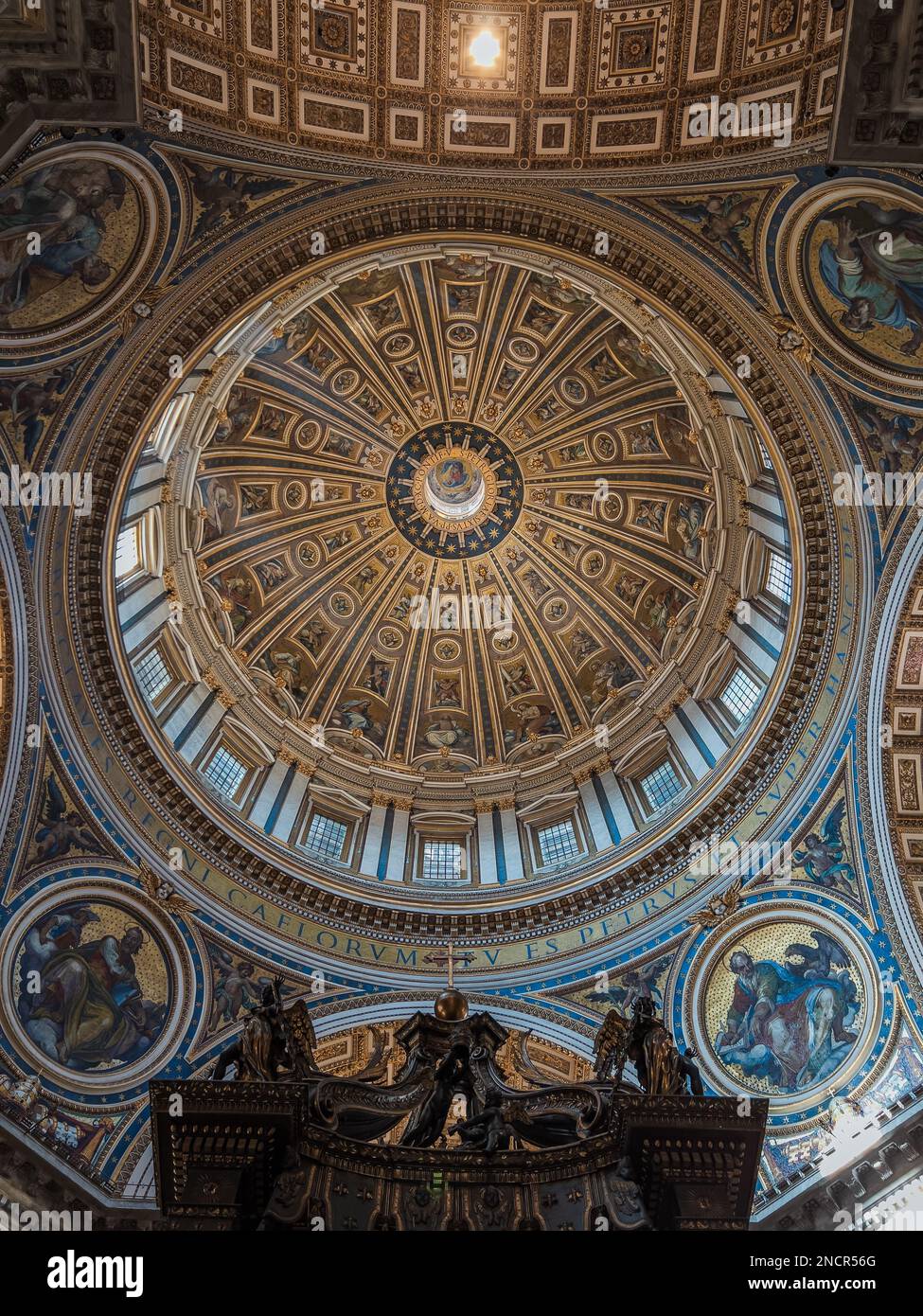 A low-angle shot of the ceiling of Basilica di San Pietro in Vatican ...