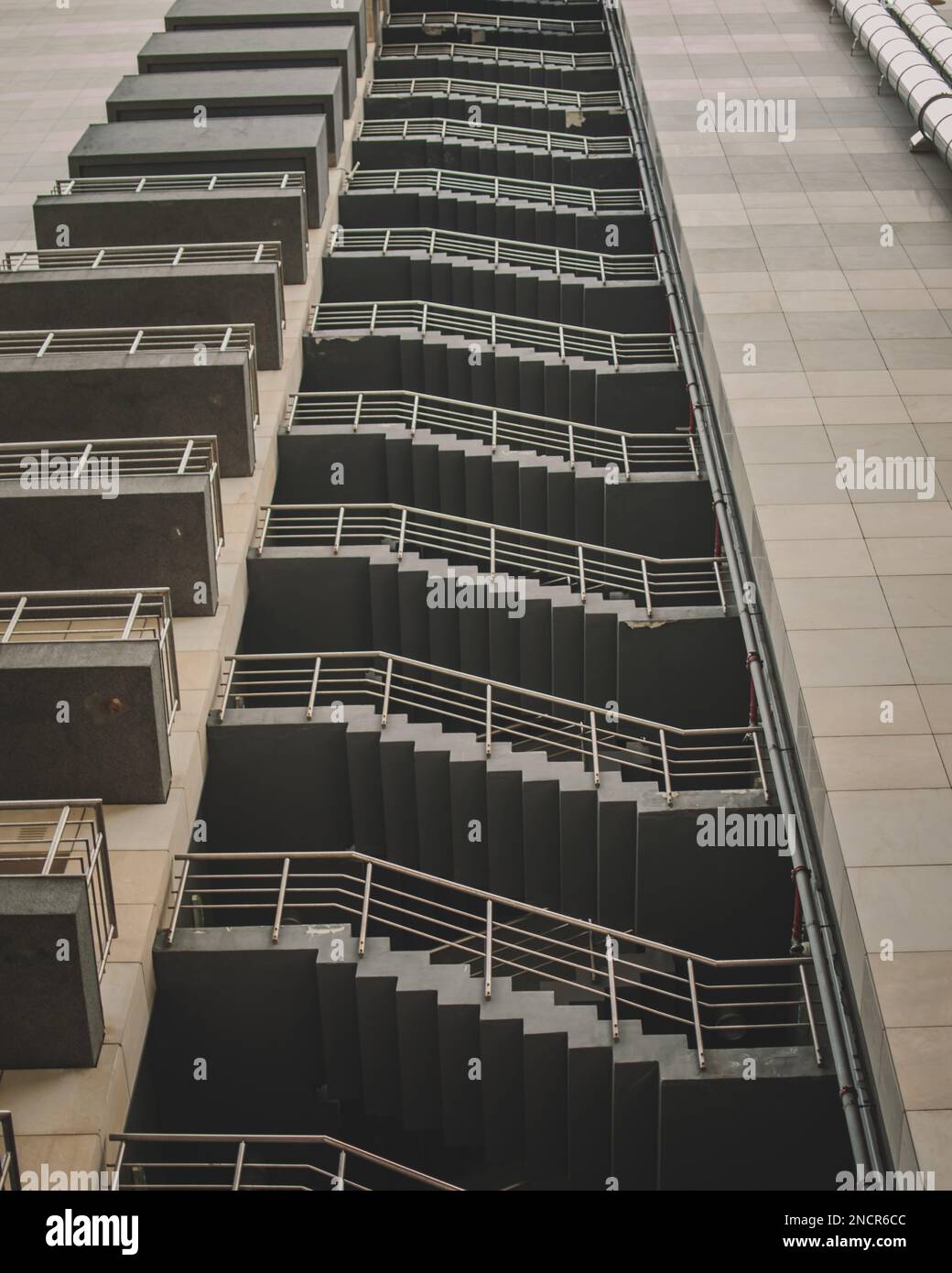A low-angle shot of the modern urban buildings with stairs Stock Photo ...