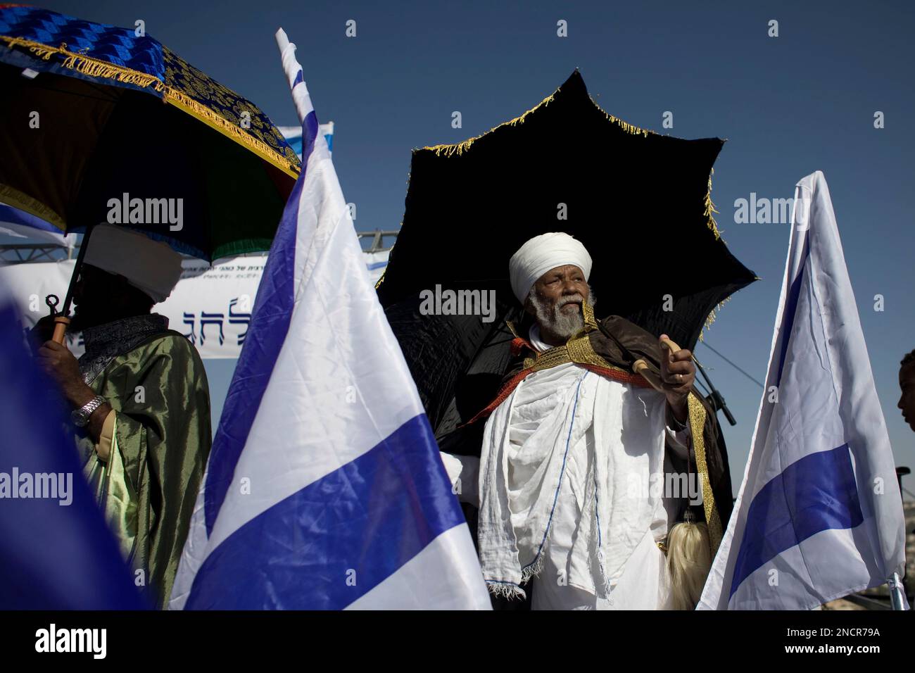 An Ethiopian Jewish elder walks onto the stage before a ceremony for ...