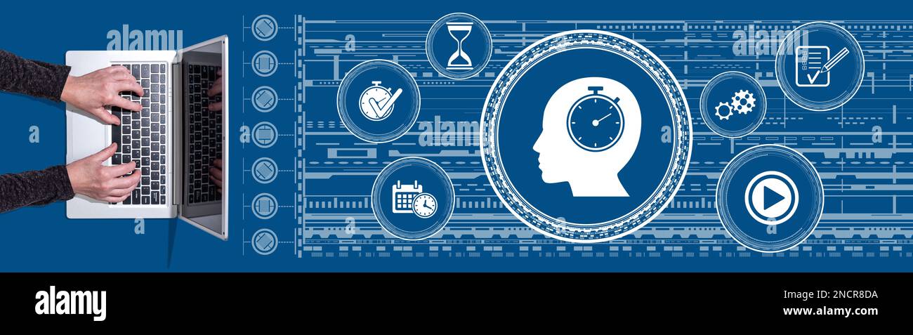 Top view of hands using laptop with symbol of time management concept ...