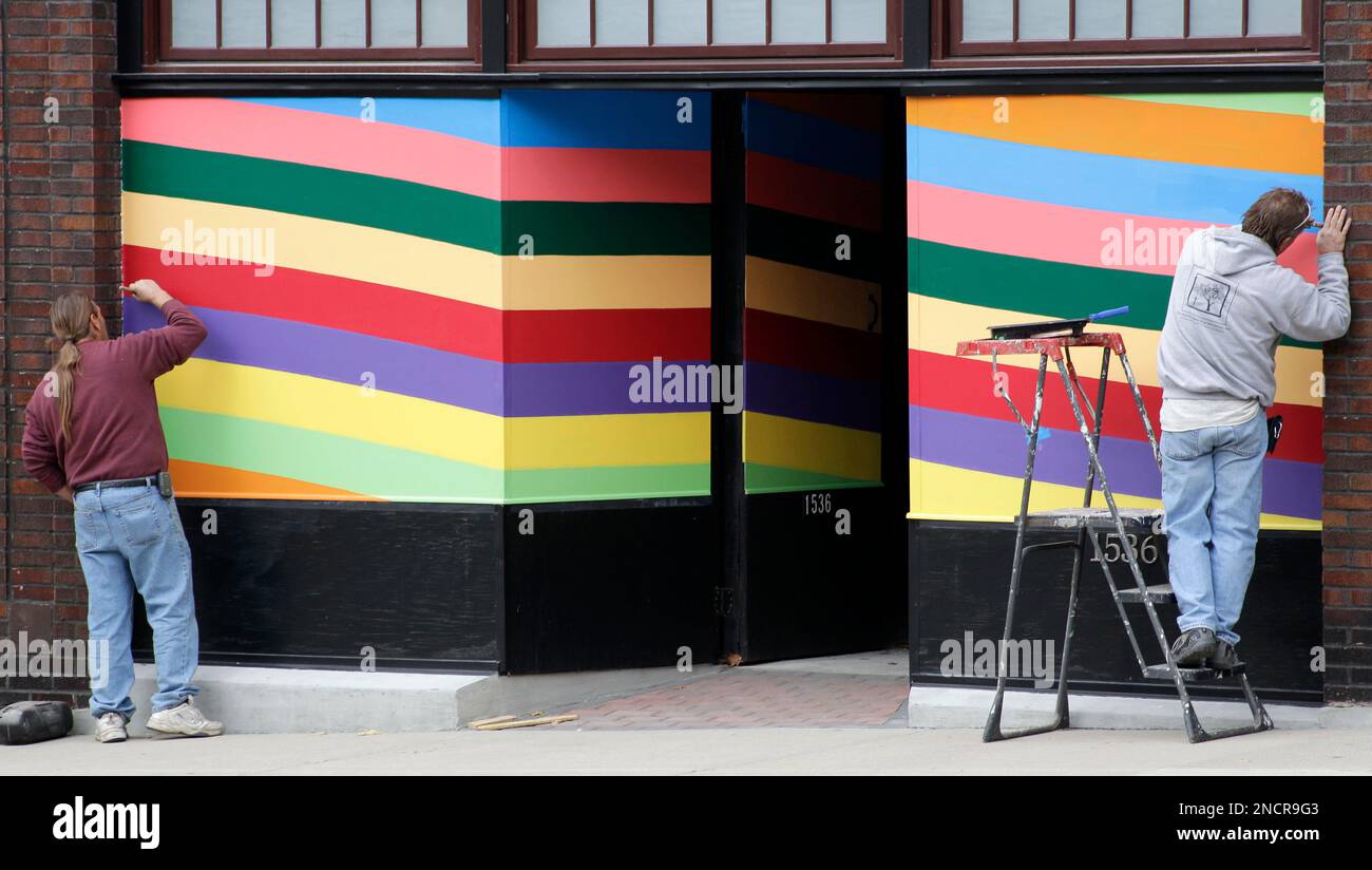 Otis Clark, left, and Jerrl Saylor paint a design on a commercial ...