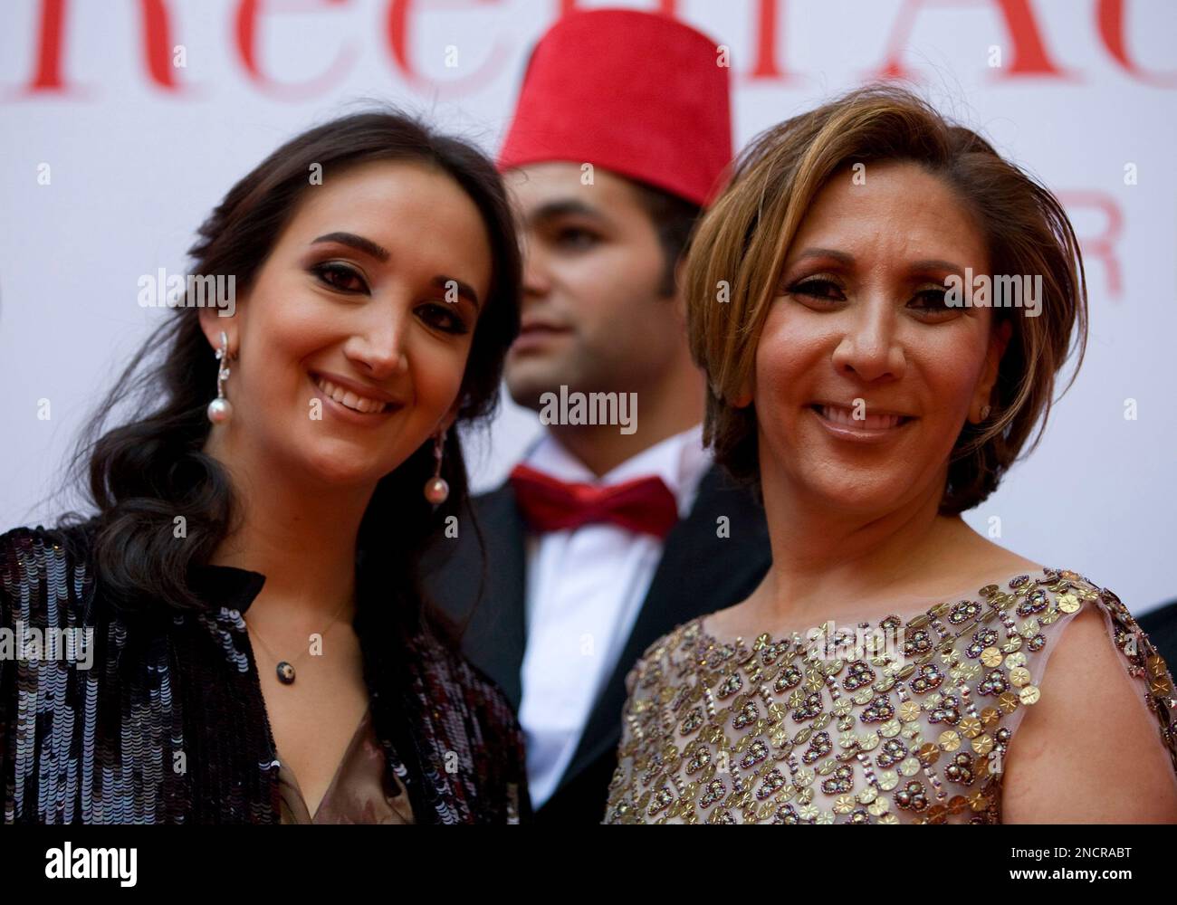 Lebanese-born New York designer Reem Acra, right, poses during the opening of her boutique with ...