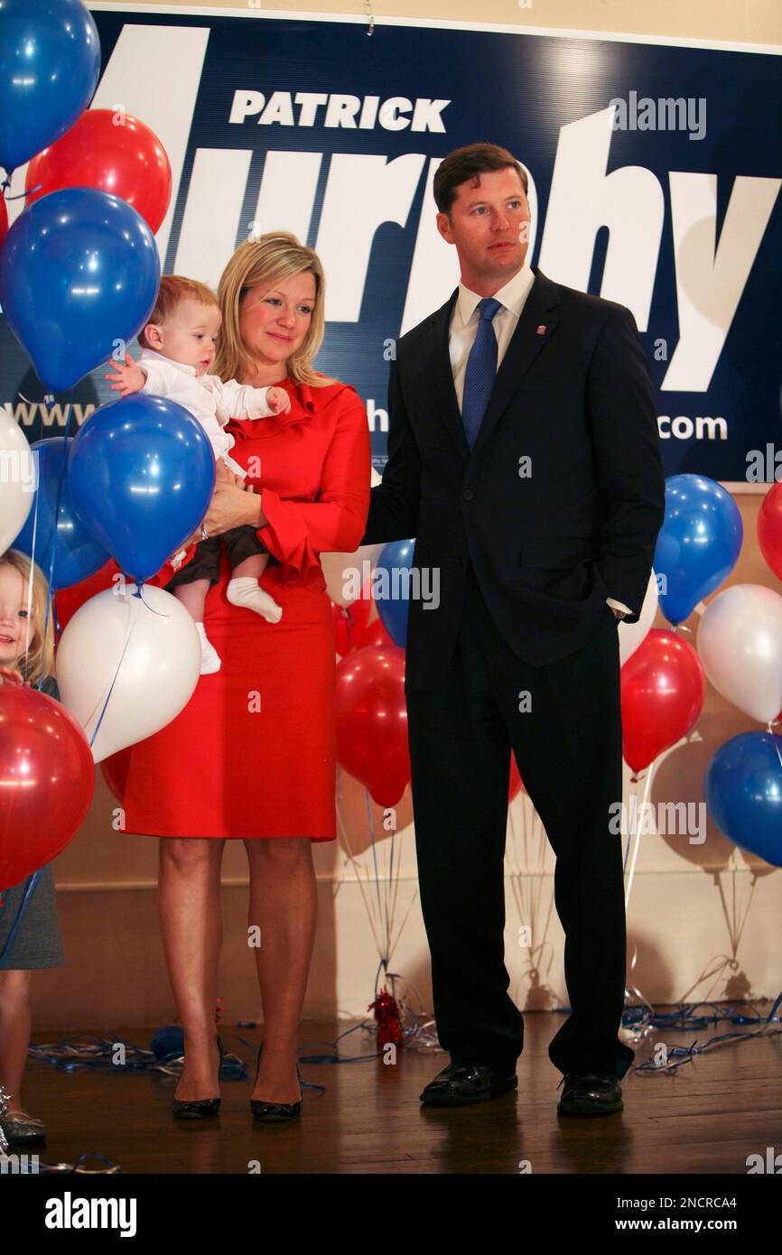 U.S. Rep. Patrick Murphy, D-Pa., stands with his wife Jenni Murphy and ...