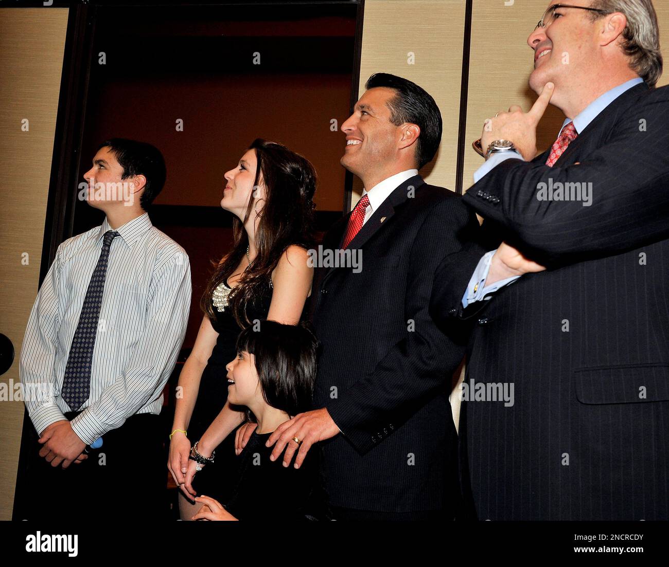 Republican Nevada governor-elect Brian Sandoval, third from left, beams ...