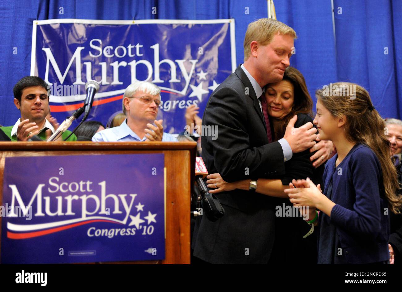 U.S. Rep. Scott Murphy, D-N.Y., hugs his wife, Jen Hogan-Murphy, as ...