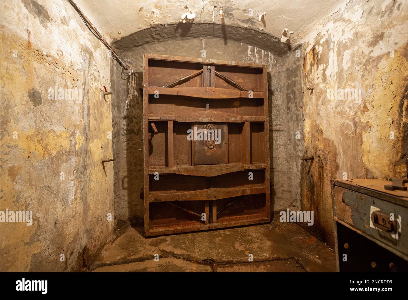 Hermetic rusty door of the bunker in underground abandoned tunnel ...
