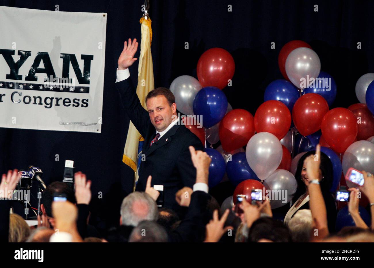 Republican Jon Runyan waves Tuesday, Nov. 2, 2010, in Mount Laurel, N.J ...