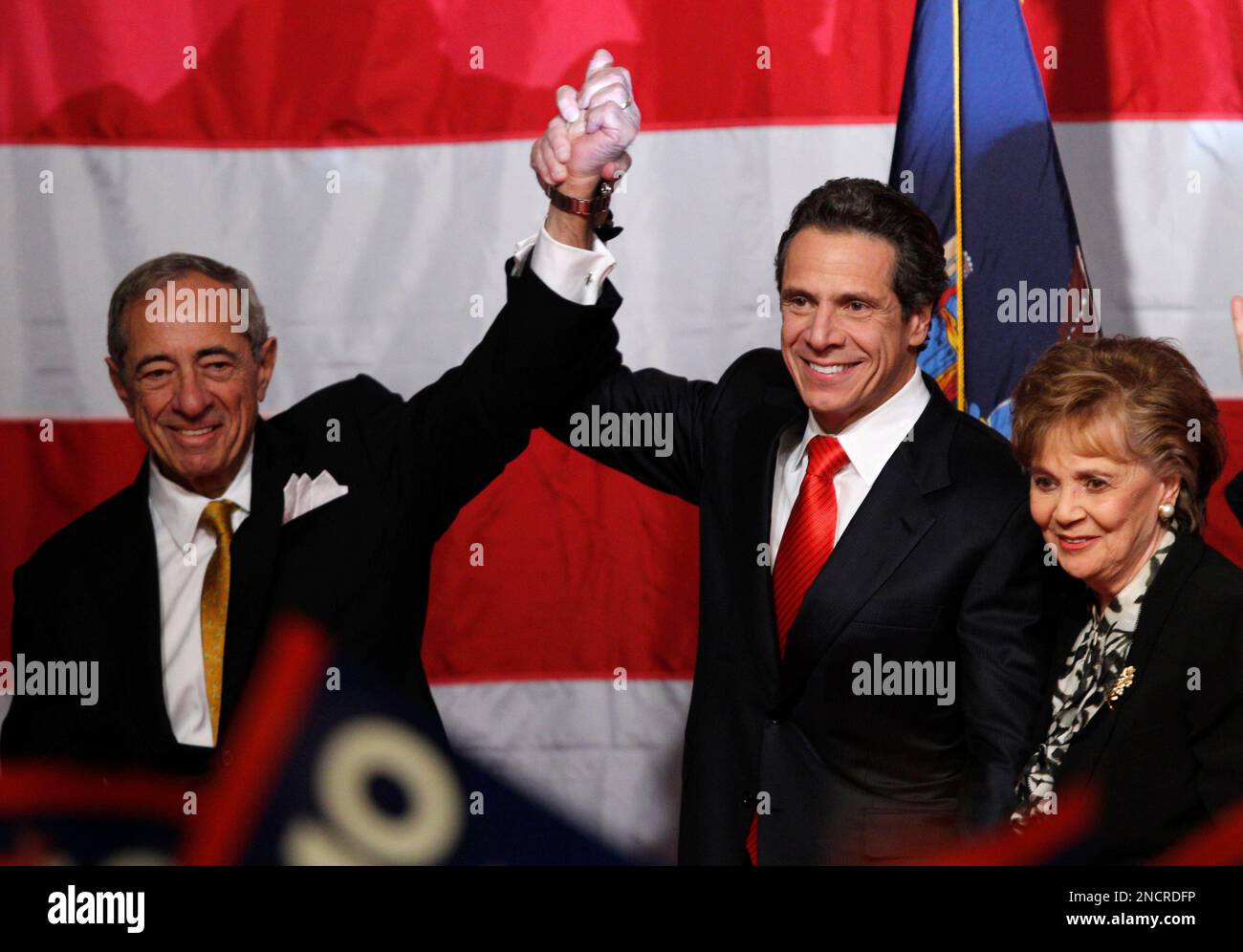 New York Governor-elect Andrew Cuomo, center, gestures with his father ...