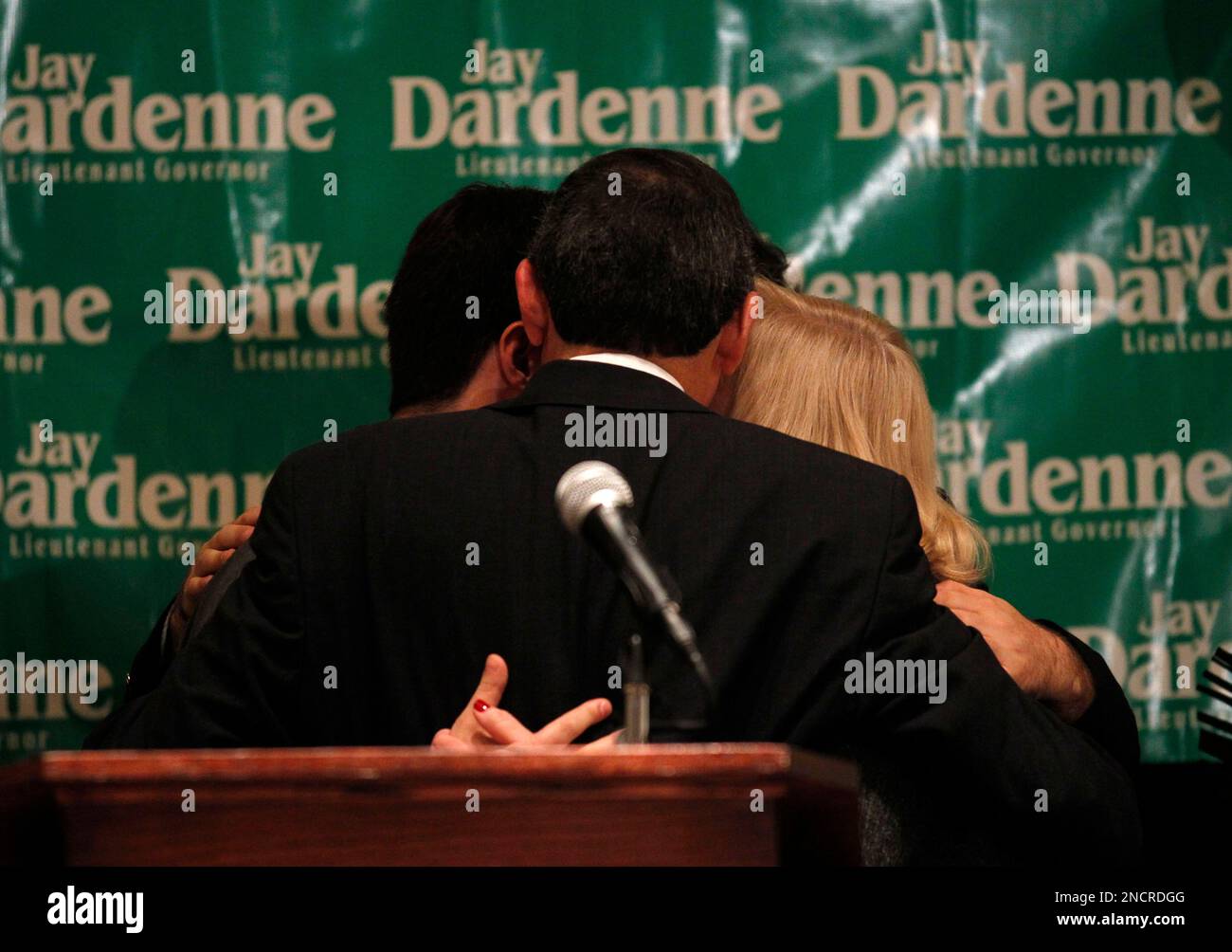 Louisiana Lieutenant Governor-elect Jay Dardenne hugs his sons Matthew, John, and his wife Cathy ...