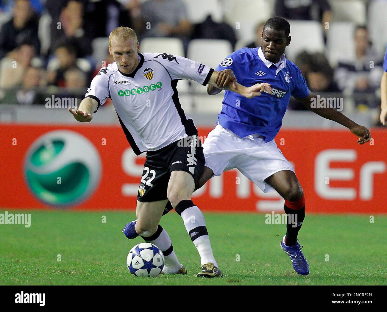 Valencia's Jeremy Mathieu from France, left, duels for the ball with ...