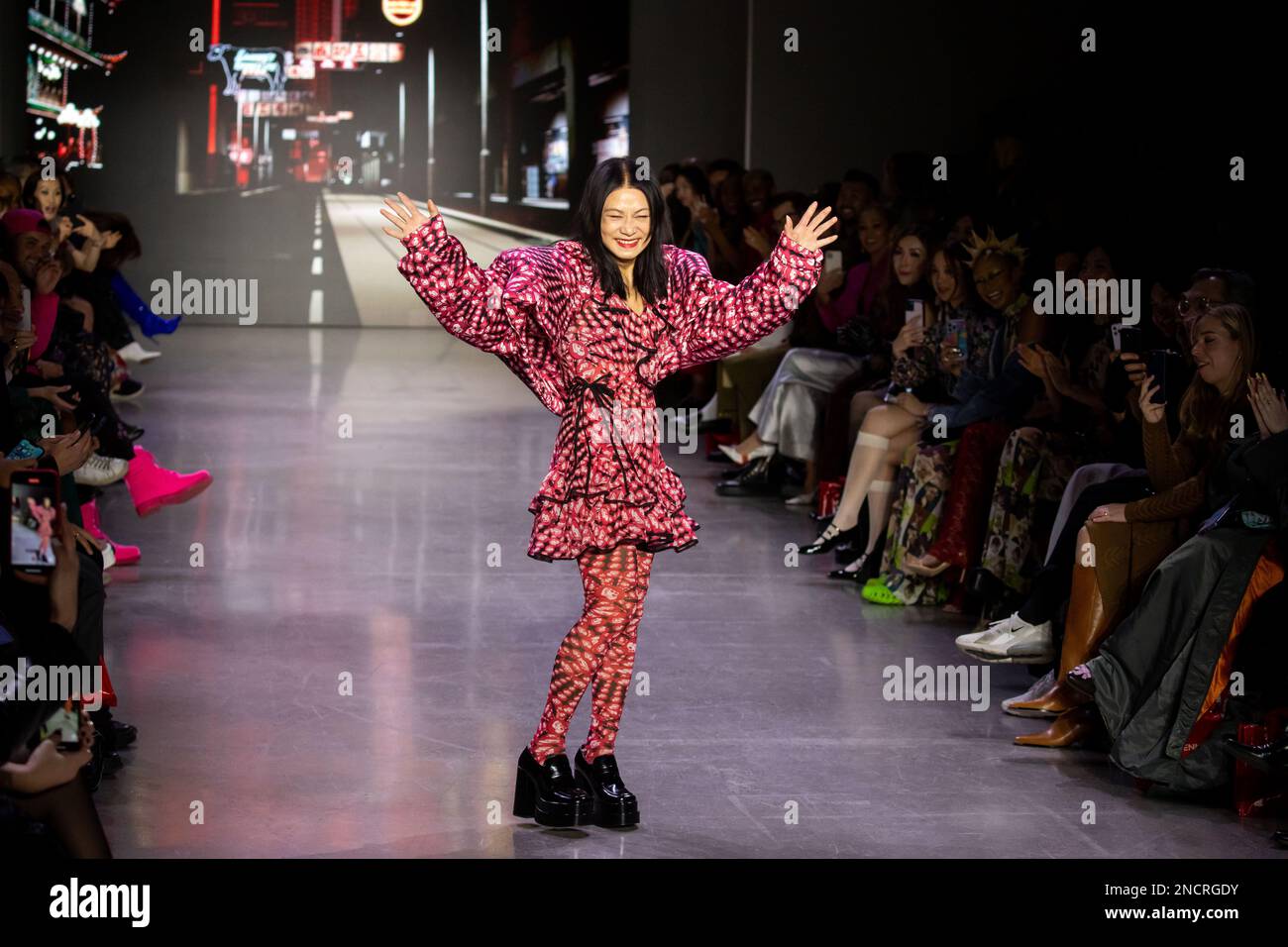New York, USA. 12th Feb, 2023. Designer Vivienne Tam waves to attendees ...