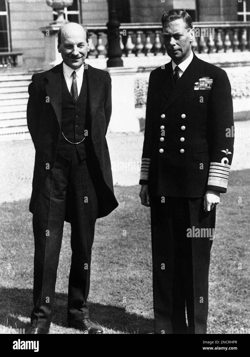 King George VI and Prime Minister Clement Attlee as they walk in the ...