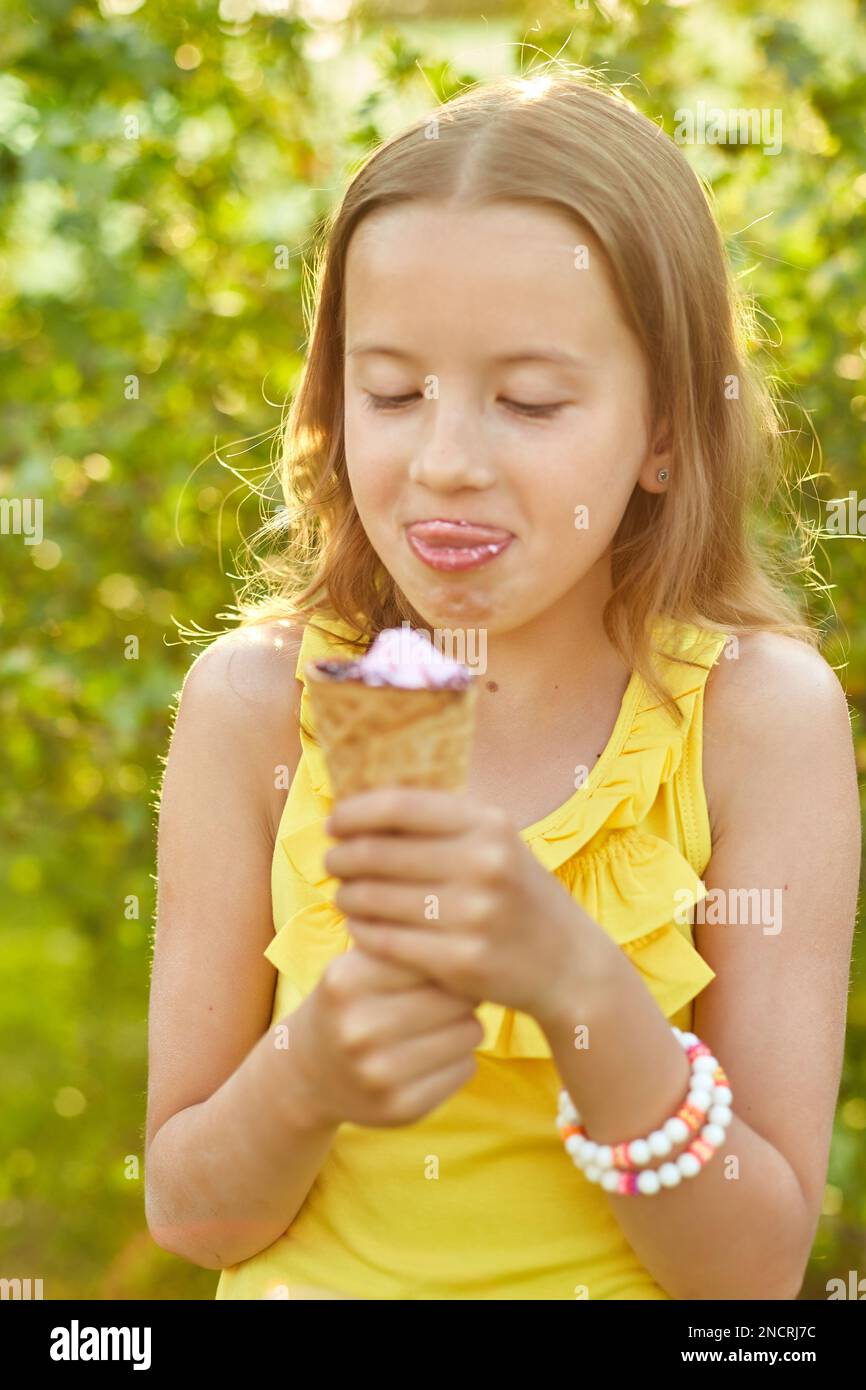 Happy Girl With Braces Eating Italian Ice Cream Cone Smiling While
