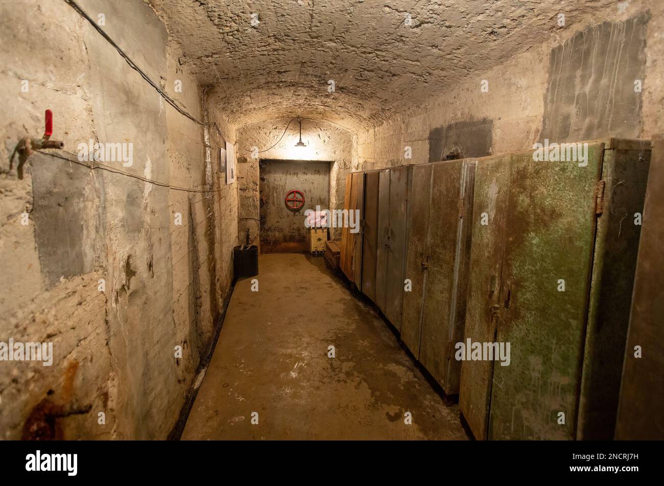 Hermetic rusty door of the bunker in underground abandoned tunnel ...