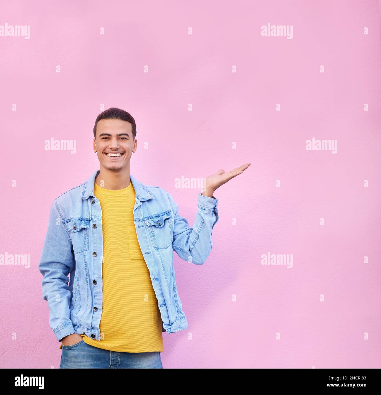 Happy, mockup and portrait of a man in a studio pointing to empty space ...