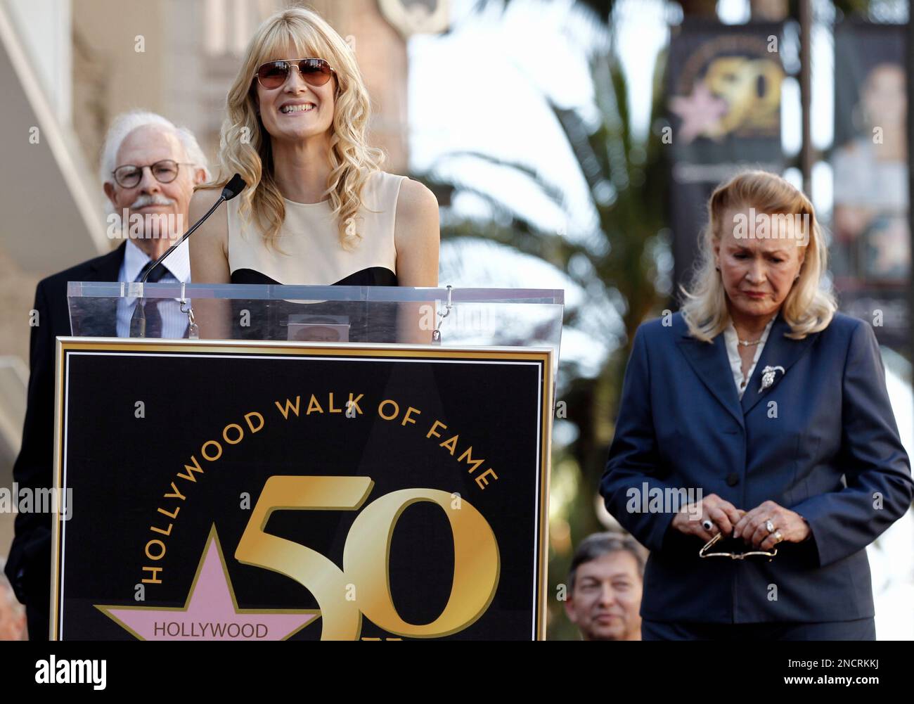 Actress Laura Dern, center, speaks as her father Bruce Dern, left, and ...