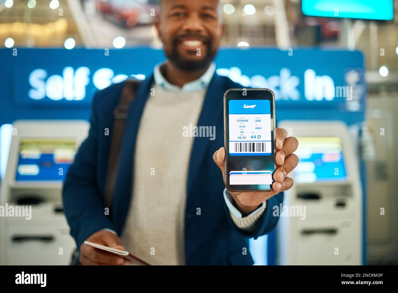 Airport, travel and man with a boarding pass on his phone to check in ...