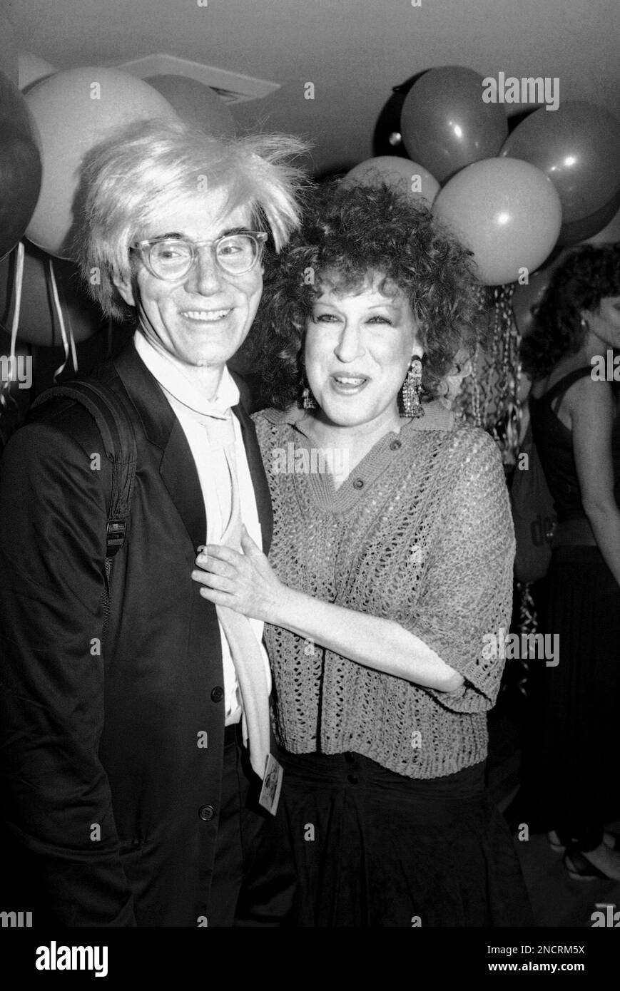 Bette Midler poses with Andy Warhol as she arrives at party at New York ...