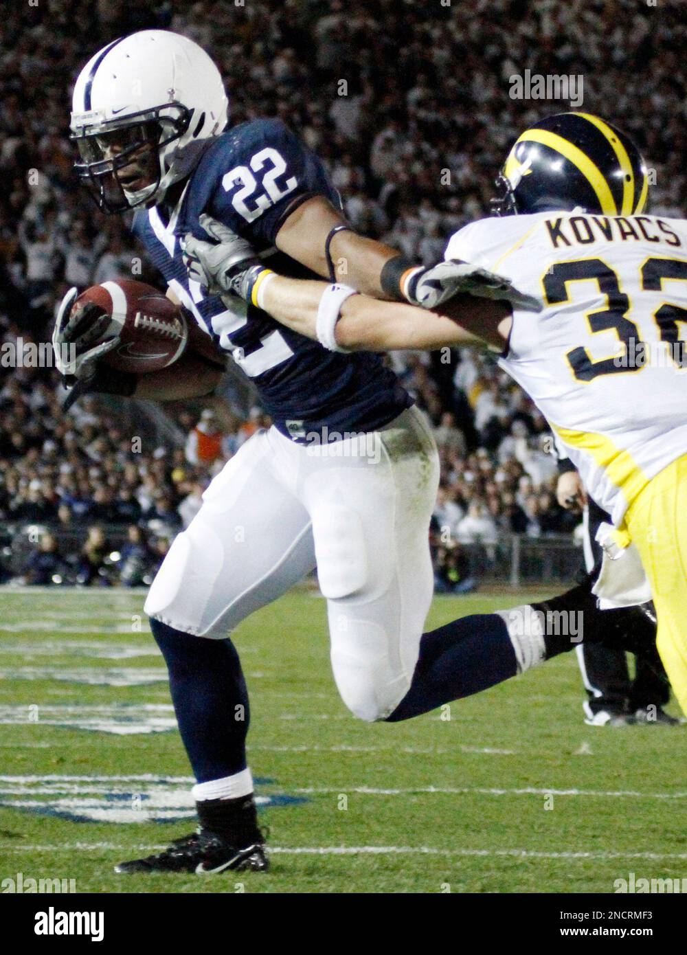 Penn State running back Evan Royster (22) gets past Michigan cornerback ...