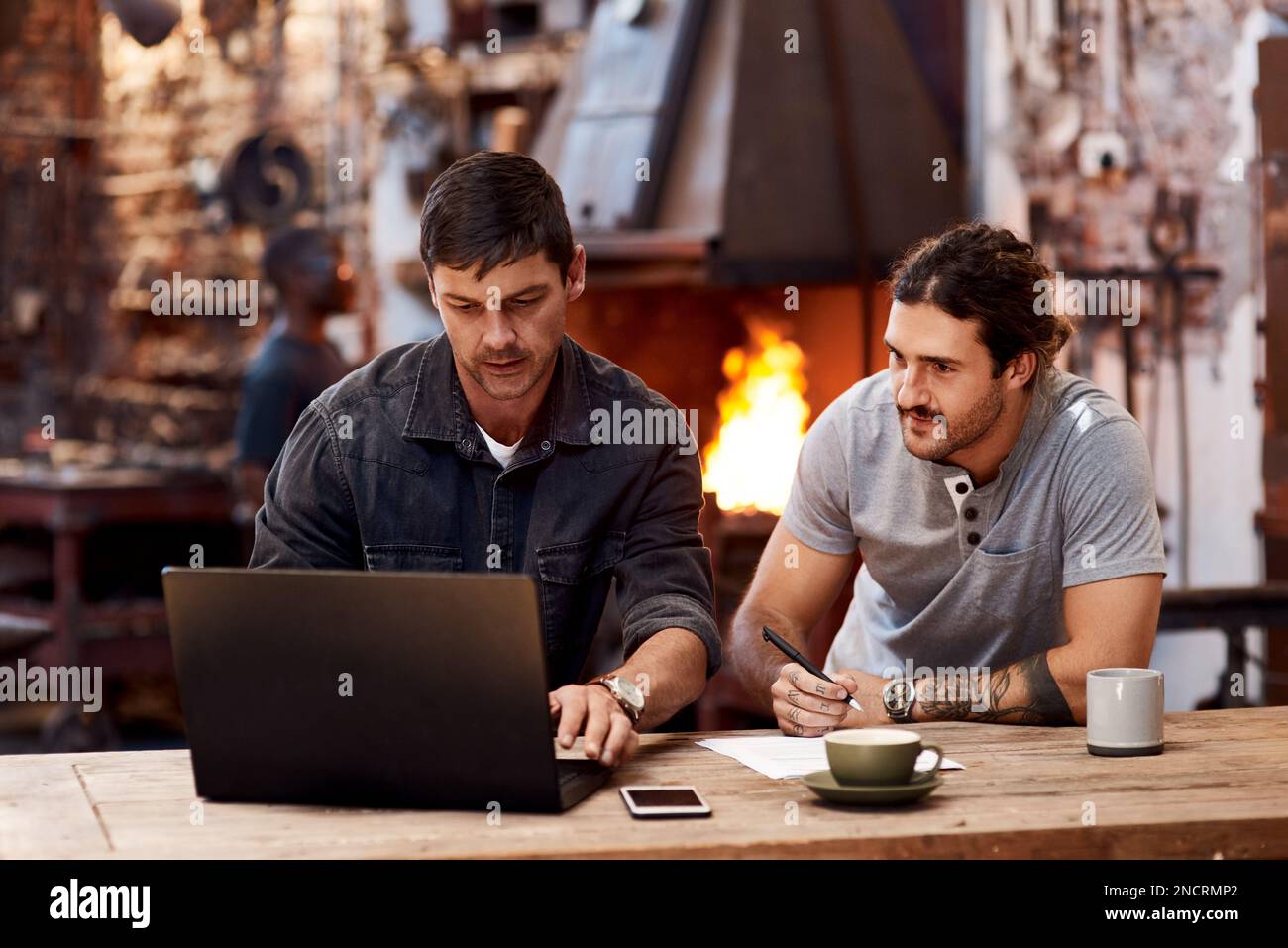 Were always productive when we work together. two handsome young using ...