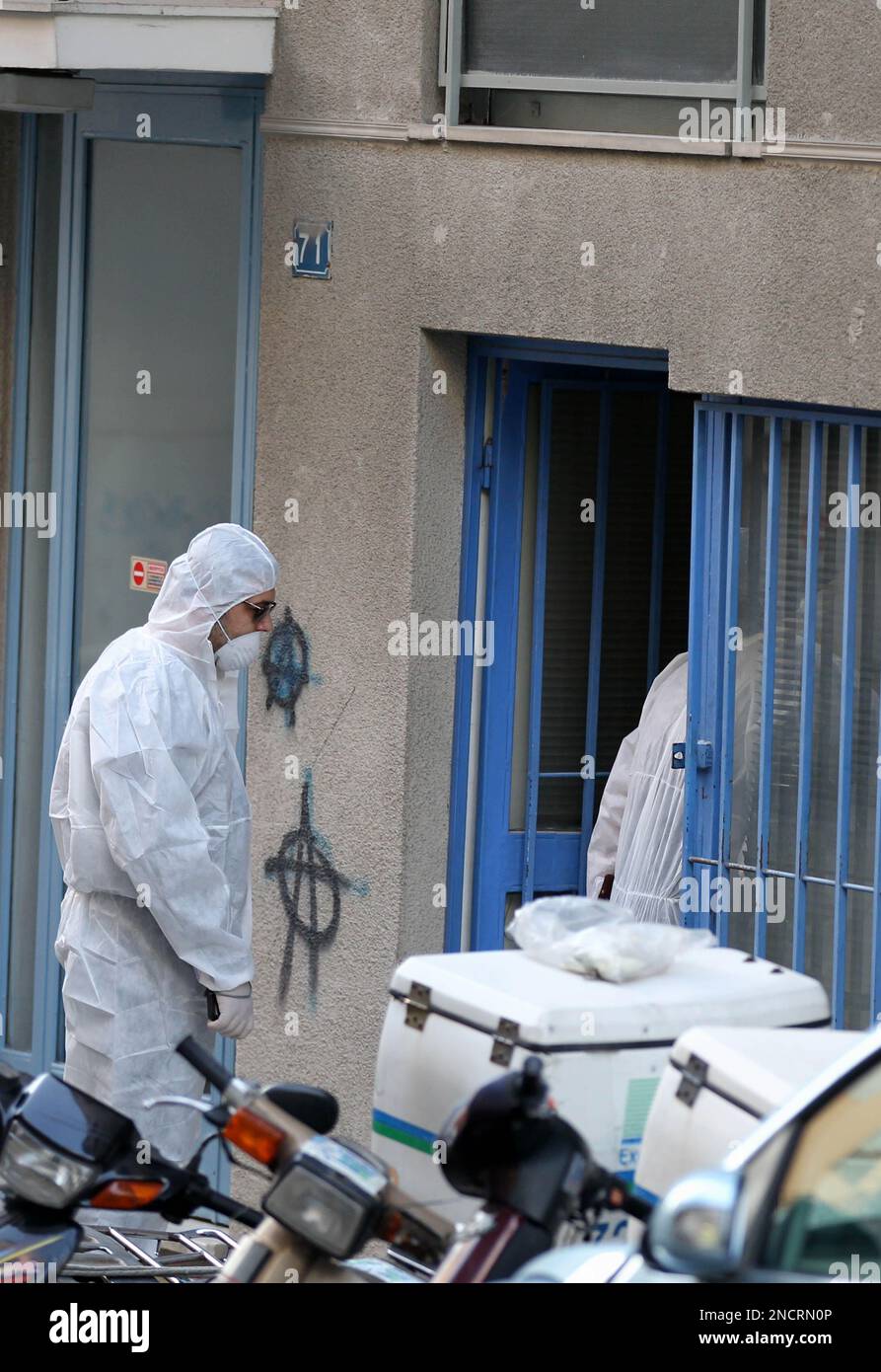 A Greek anti-terrorist police officer investigates a private delivery ...