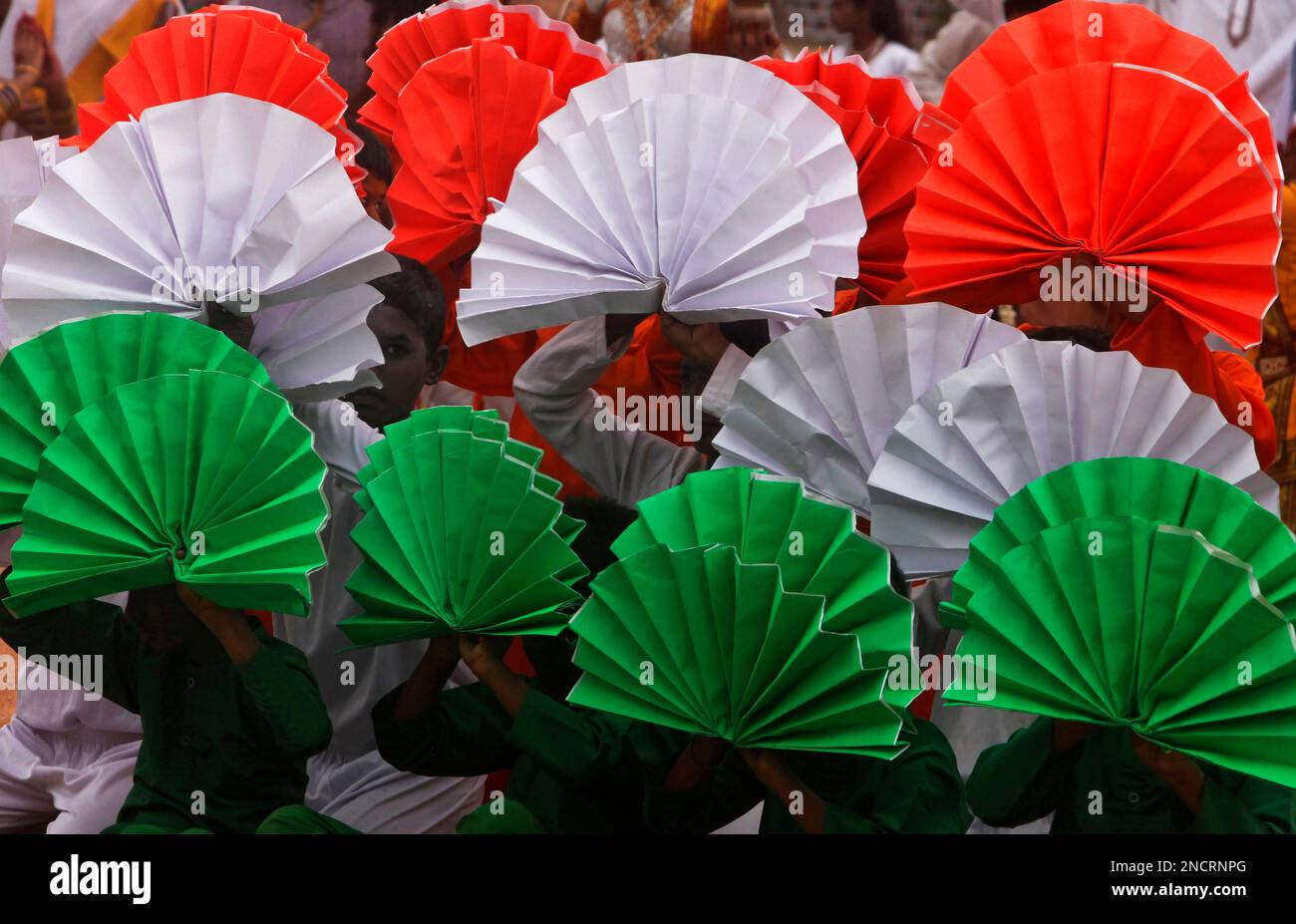 Indian school children perform a display with tri color during the ...