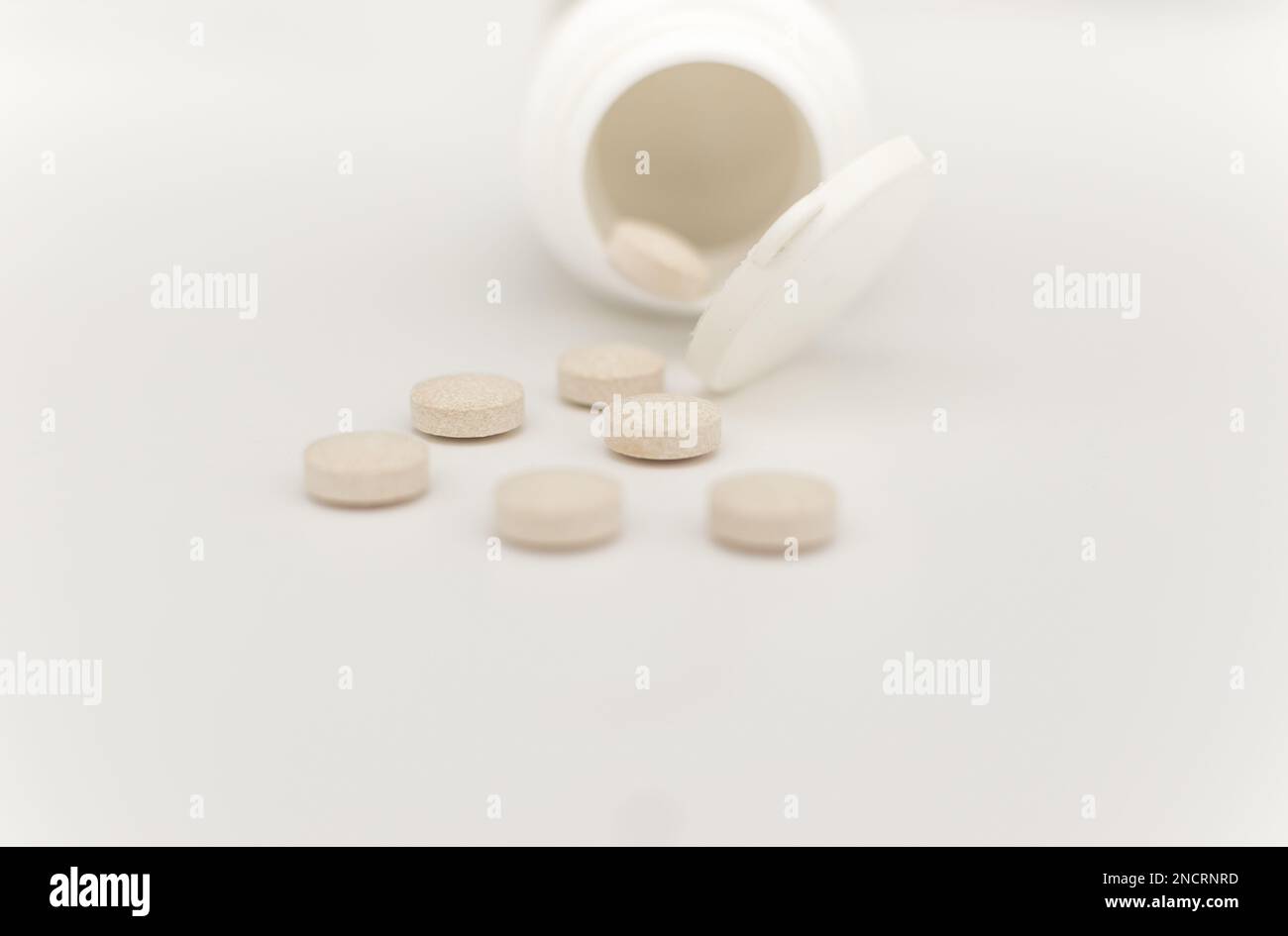 vitamins pill tablets on white background Stock Photo - Alamy