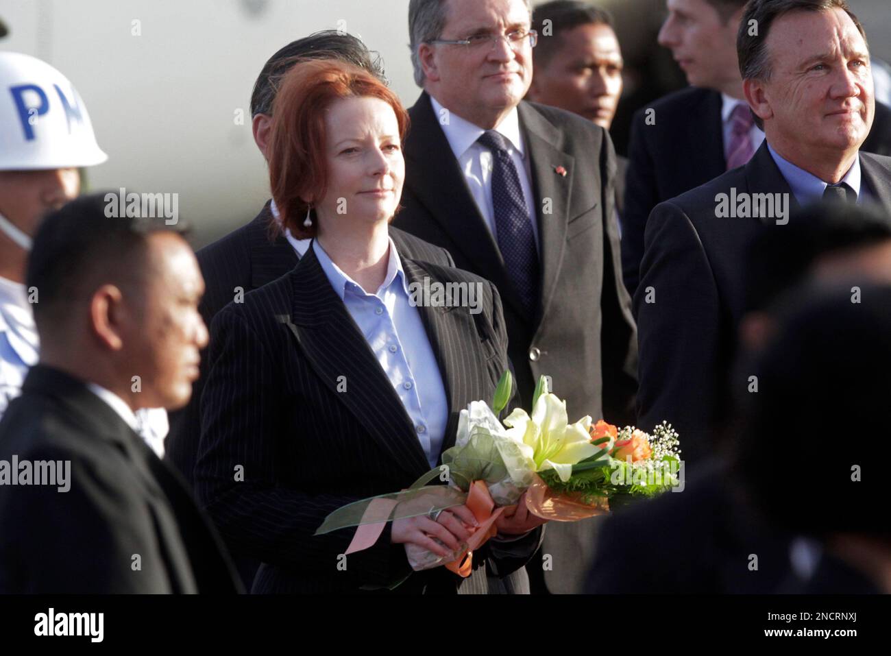 Australian Prime Minister Julia Gillard, center, walks with her partner ...