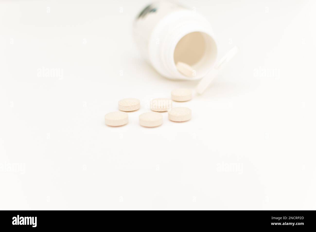 vitamins pill tablets on white background Stock Photo - Alamy