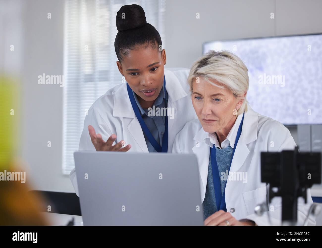 Laptop, teamwork and doctors planning in laboratory for medical ...