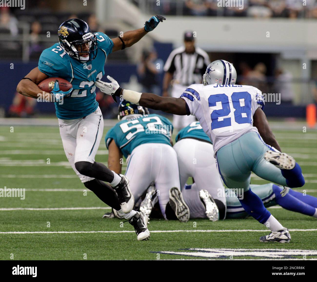 Jacksonville cornerback Derek Cox runs back an interception as Dallas ...