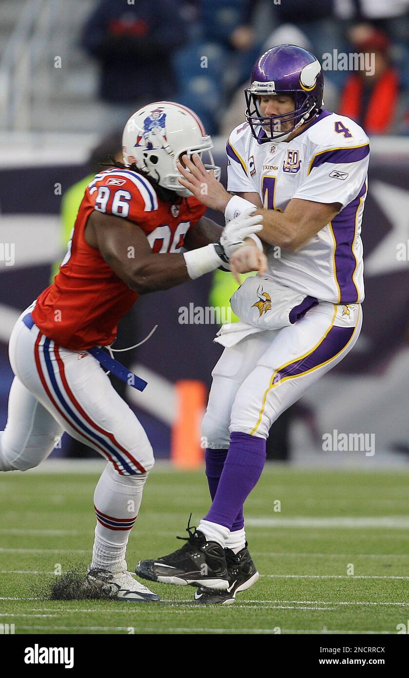 Minnesota Vikings quarterback Brett Favre (4) is hit by New England ...