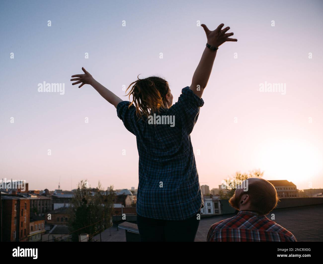 Freedom life. Relief from problems on roof Stock Photo - Alamy