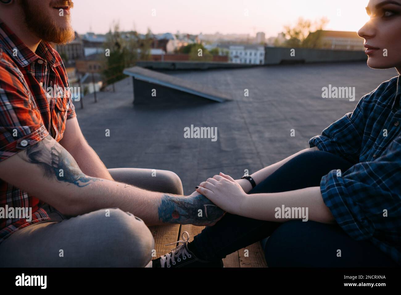 Trustful relationships. Romantic date on roof Stock Photo - Alamy