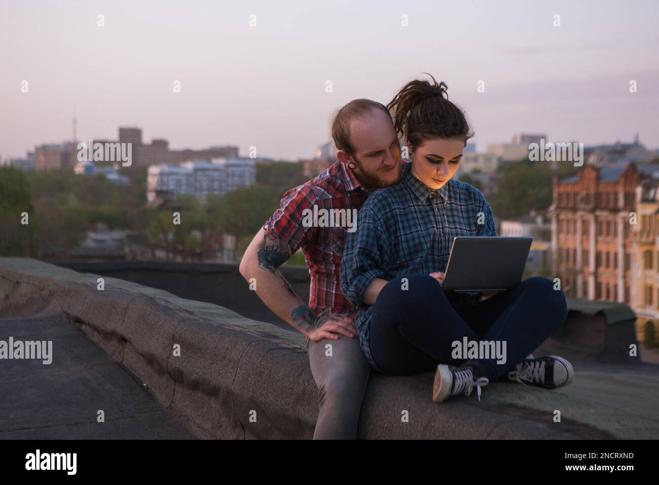 Busy working female. Couple distraction Stock Photo - Alamy