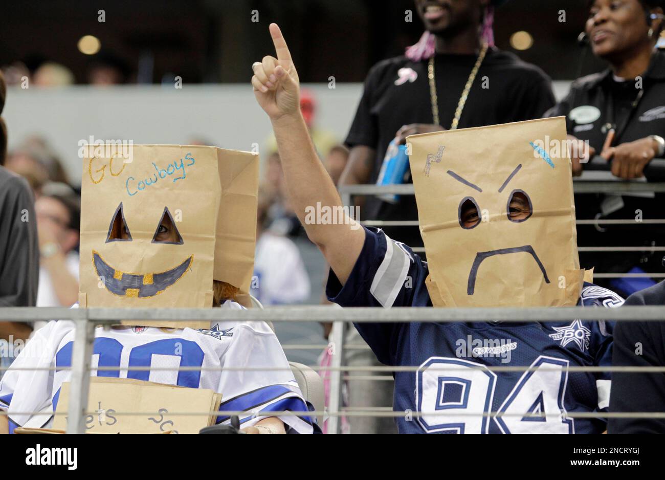 Dallas Cowboys fans wear paper bags over their heads before an NFL ...