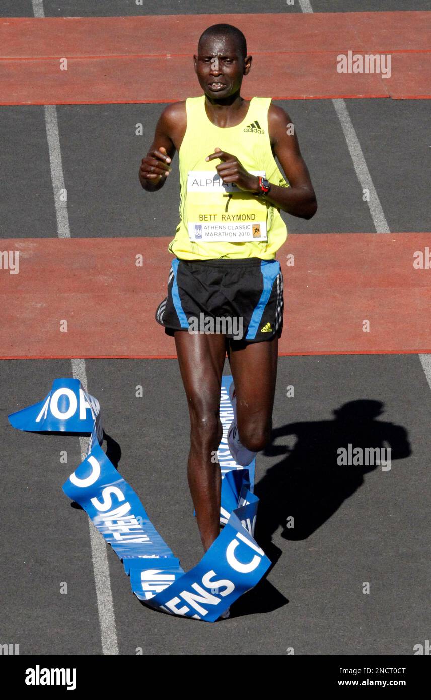Kenya's Raymond Bett crosses the finishing line of the Athens Classic ...