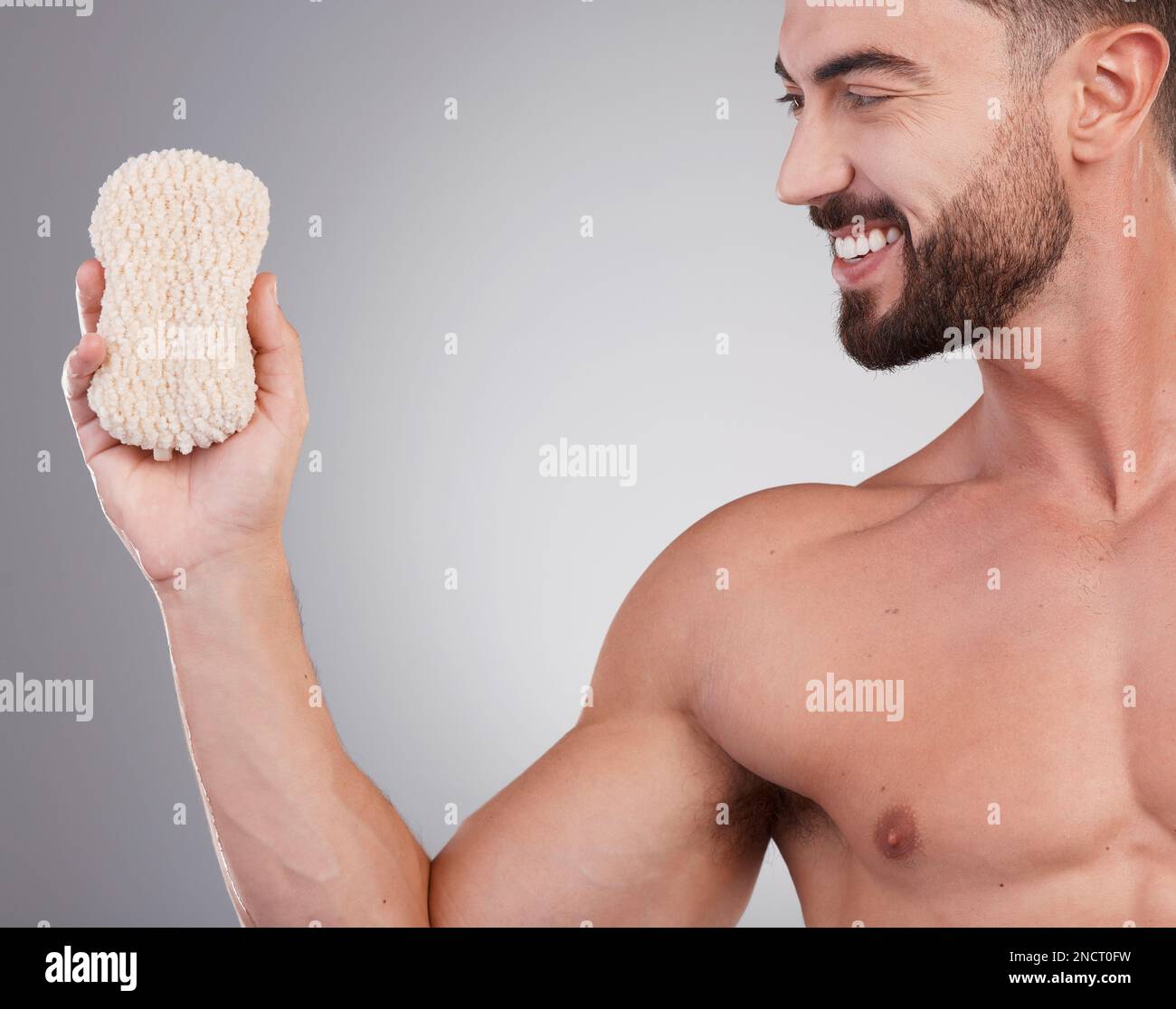 Hygiene, man and sponge for cleaning, smile and wellness with guy on ...