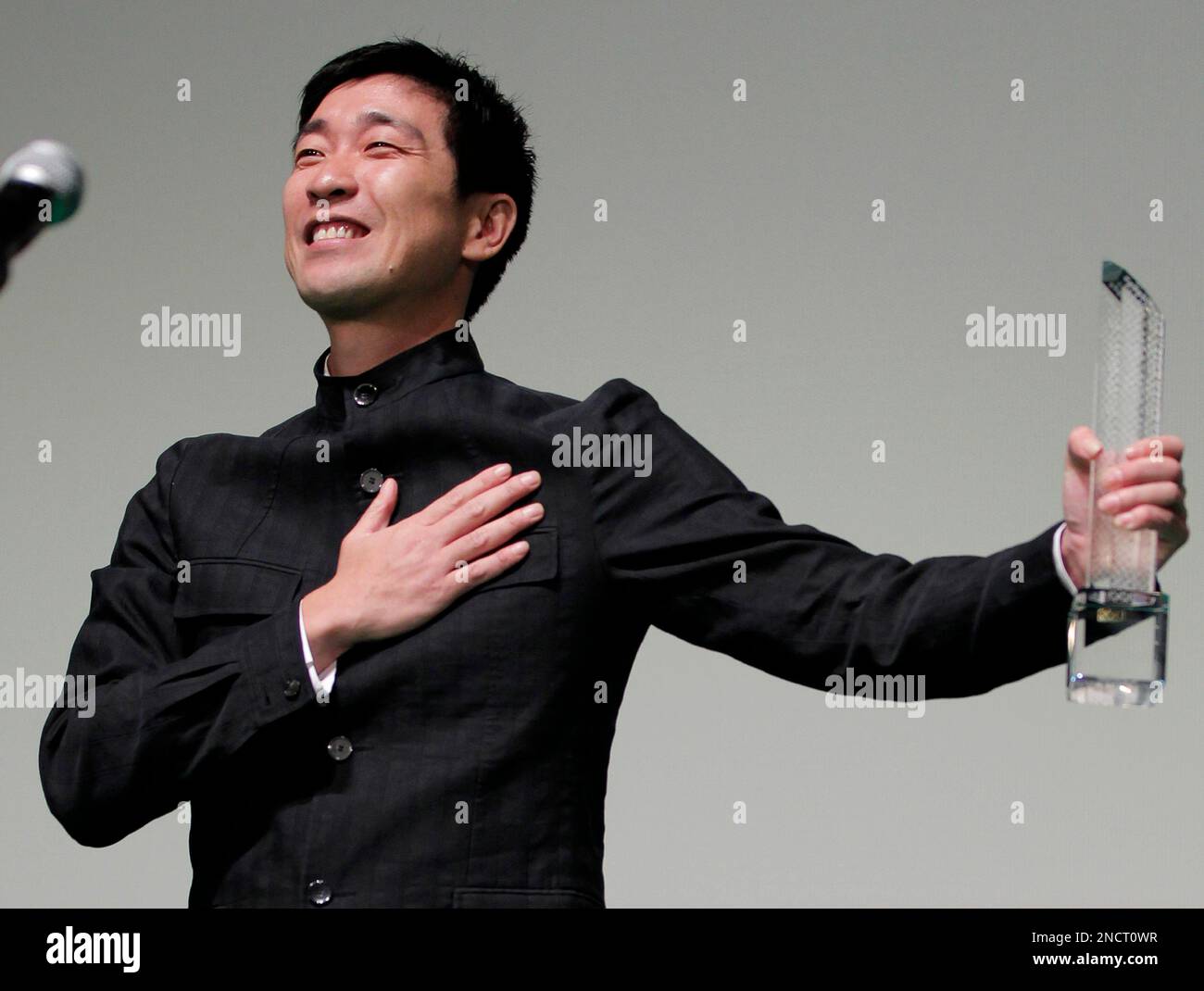 Chinese actor Wang Qian-yuan celebrates after winning the Award for ...