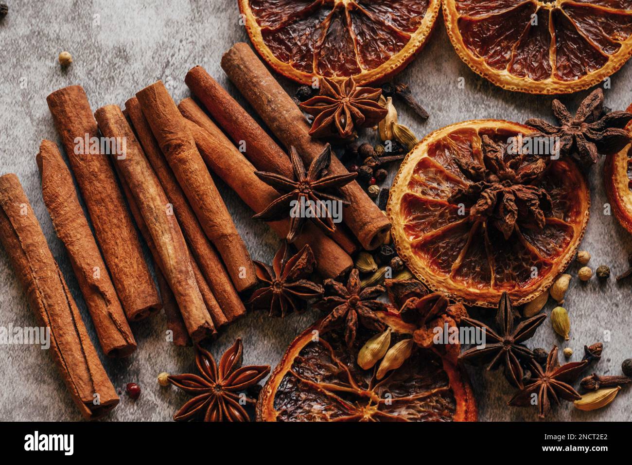 Christmas spice background. Cinnamon, dried oranges anise grey ...