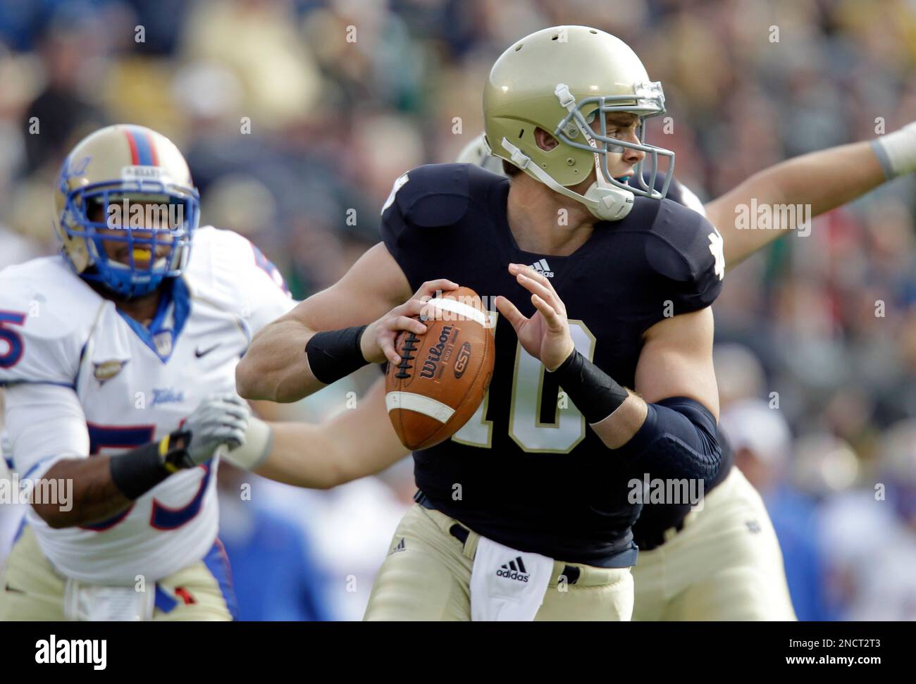 Notre Dame quarterback Dayne Crist drops back to throw in front of ...
