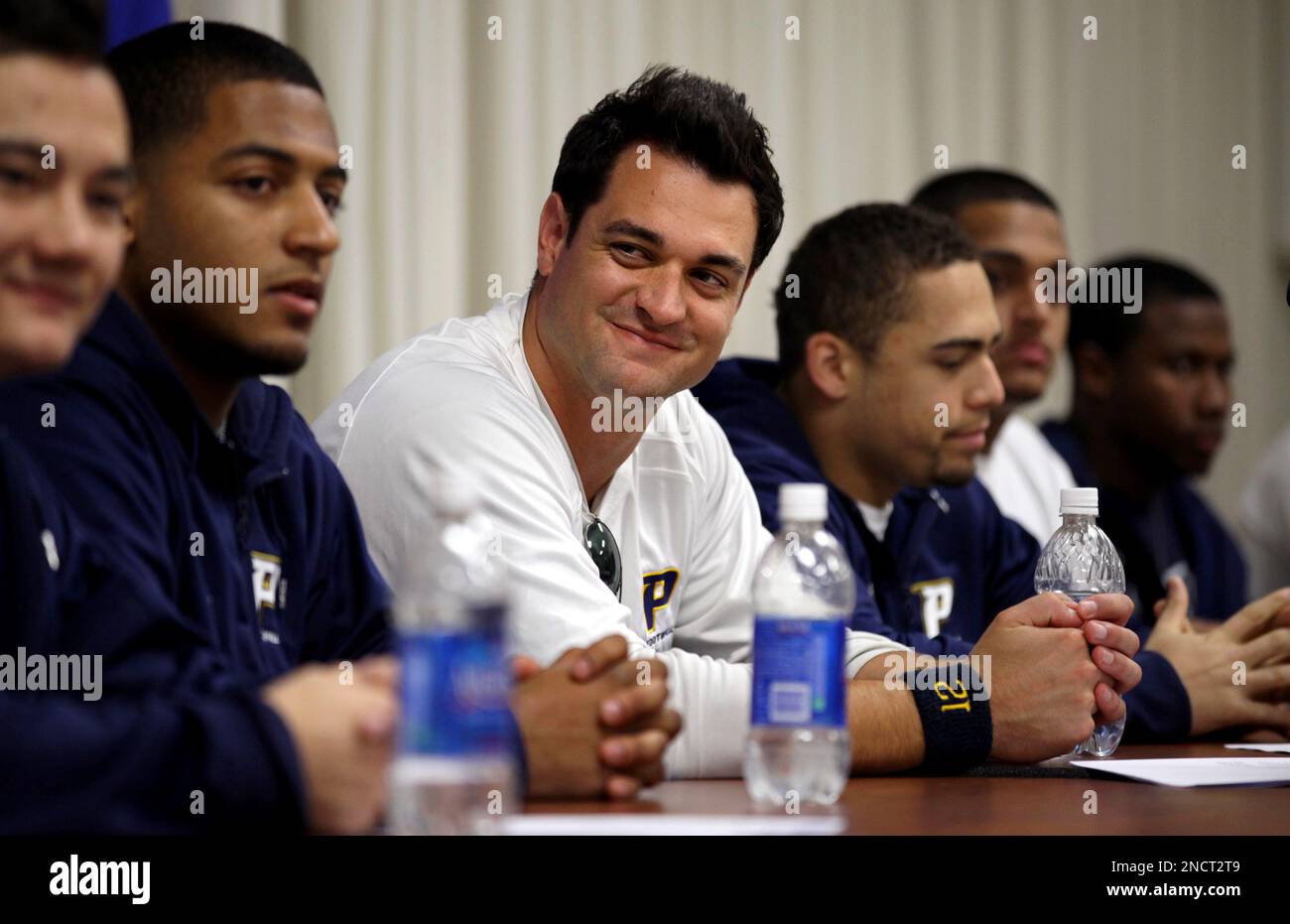 Pace University head football coach Chris Dapolito, center, smiles ...