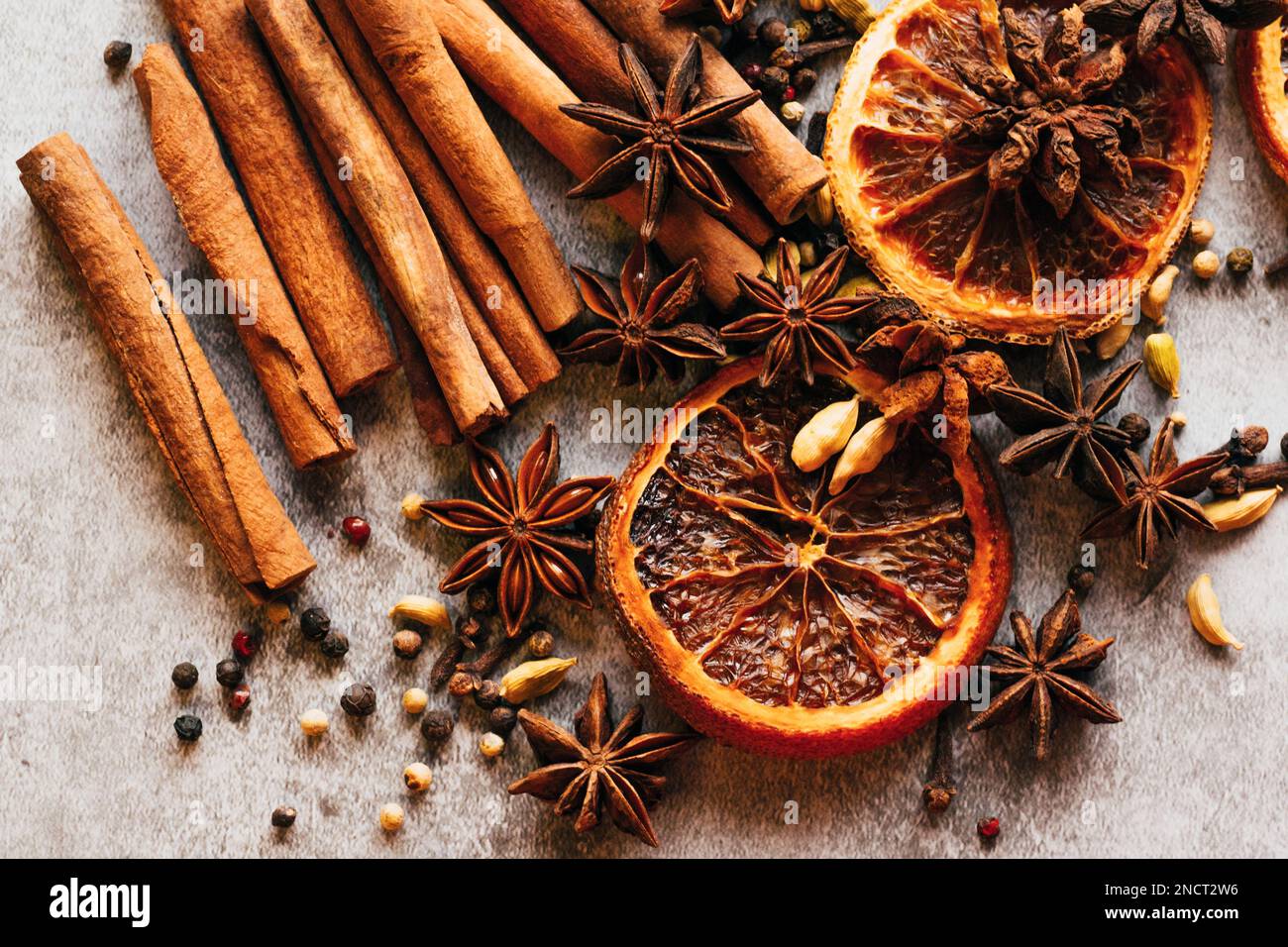 Christmas spice background. Cinnamon, dried oranges anise grey ...