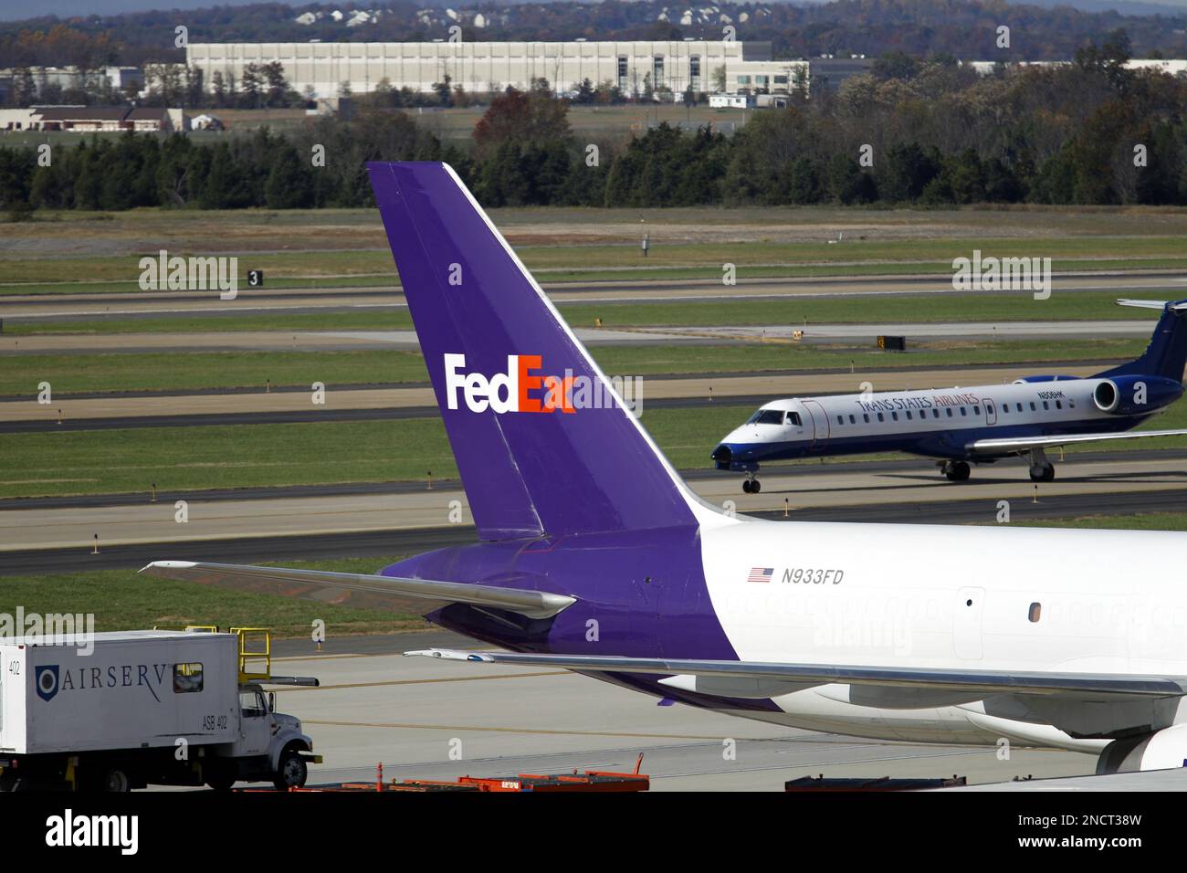 A FedEx jet sits at the cargo terminal at Dulles International Airport ...
